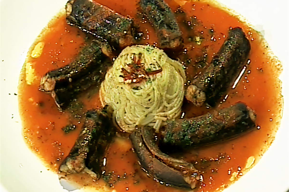 Anguila con timbal de spaghetti - El Gourmet
